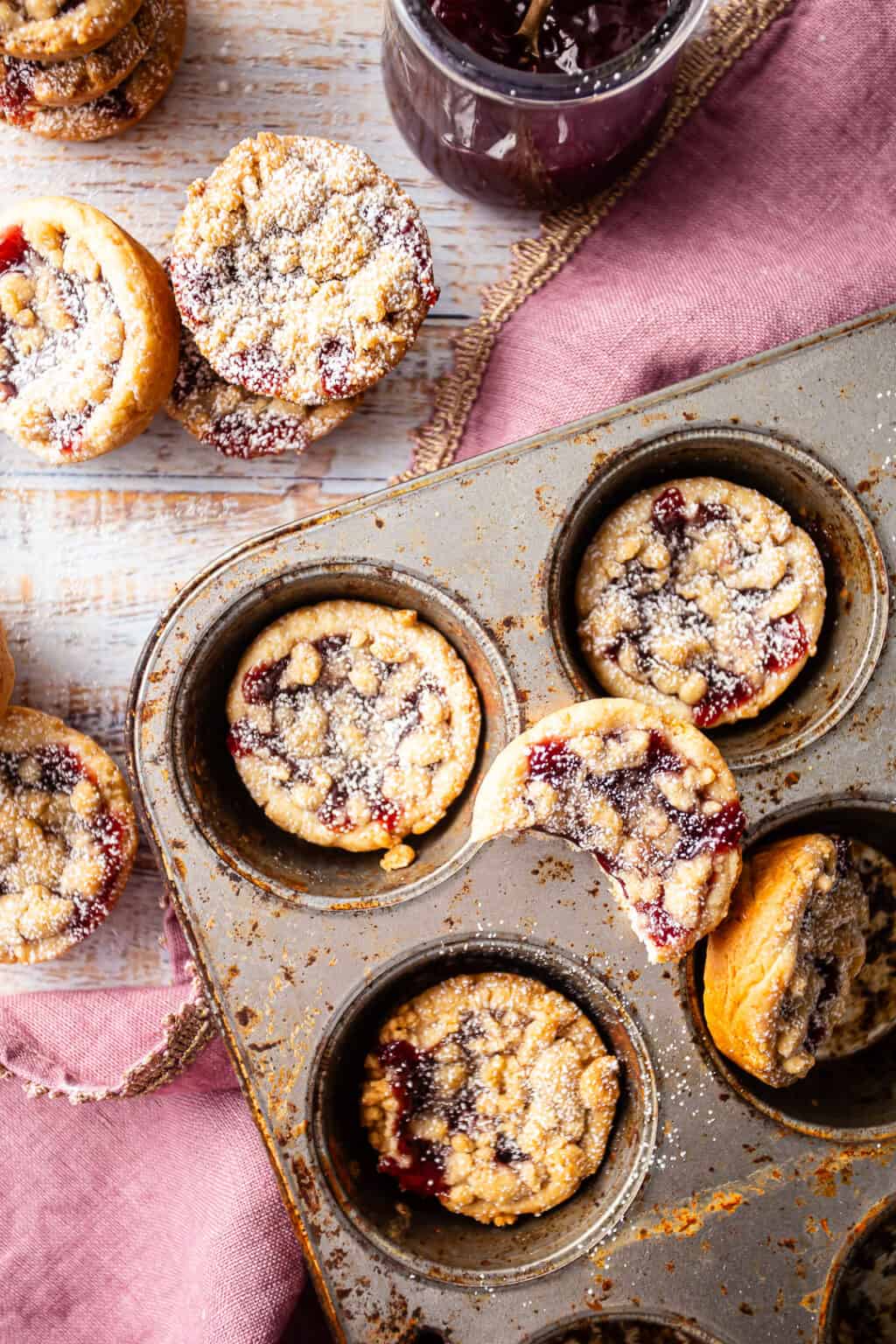 Mini Tarts: Buttery crust, jam filled with streusel -Baking a Moment